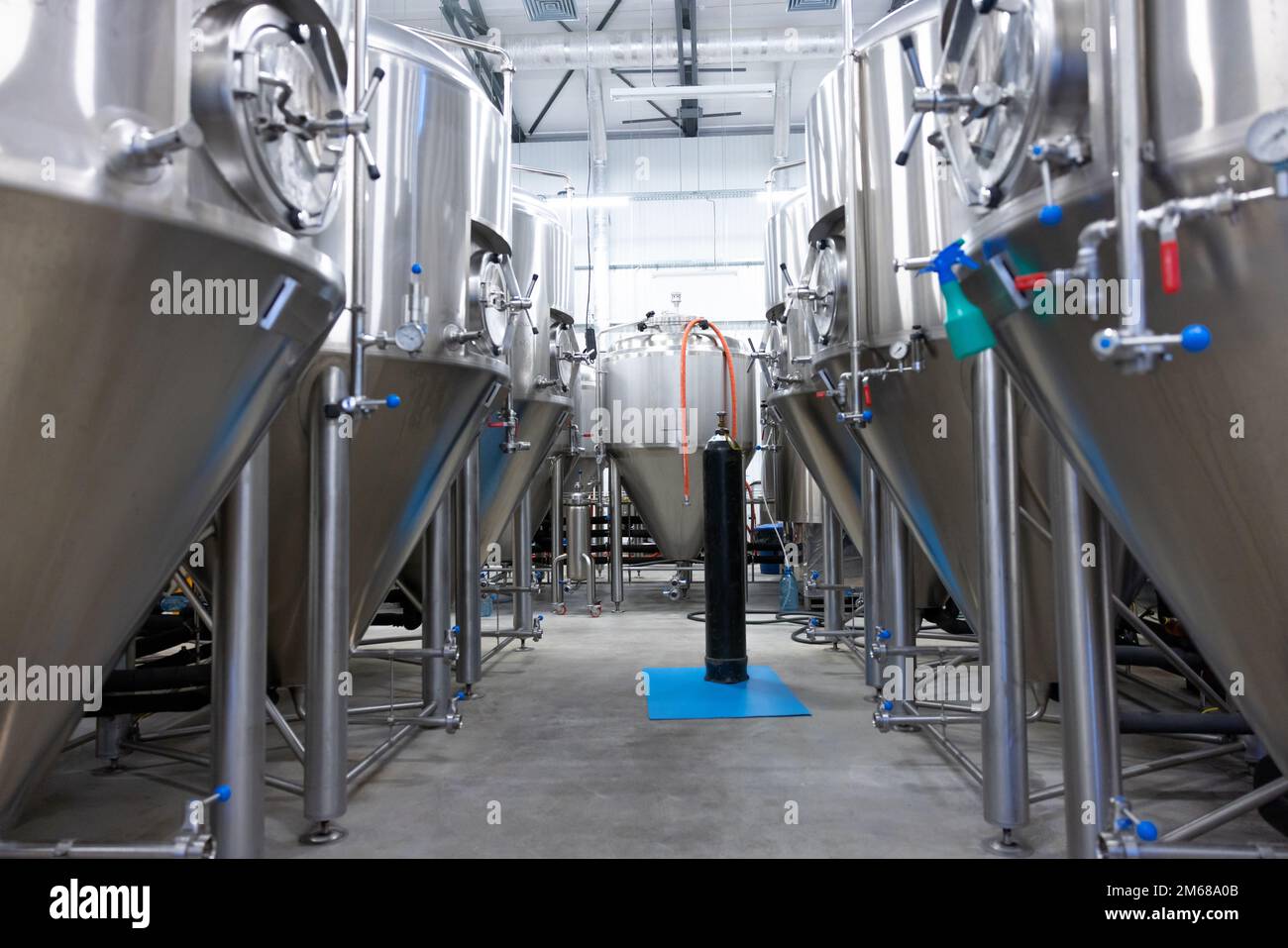 Interior of a brewery with big metal vats Stock Photo - Alamy
