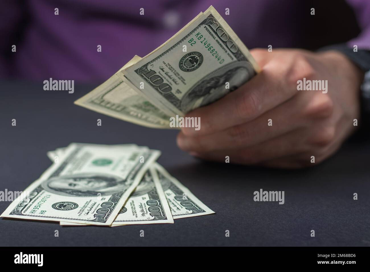 Closeup male counting money 100 hi-res stock photography and images - Alamy
