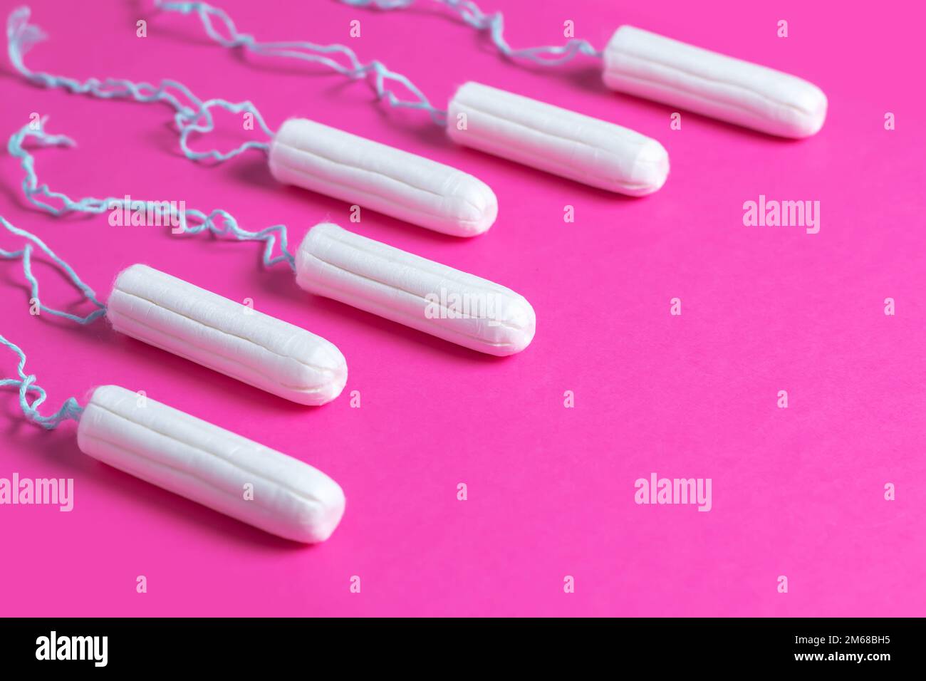 Menstrual period concept. Woman hygiene protection. Cotton tampons on ...