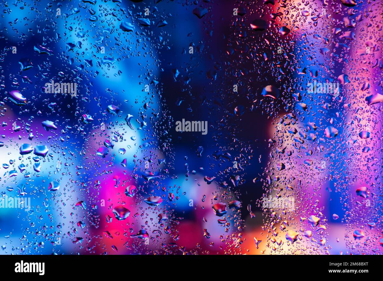 Rain drops and condensation on the window glass against the background ...