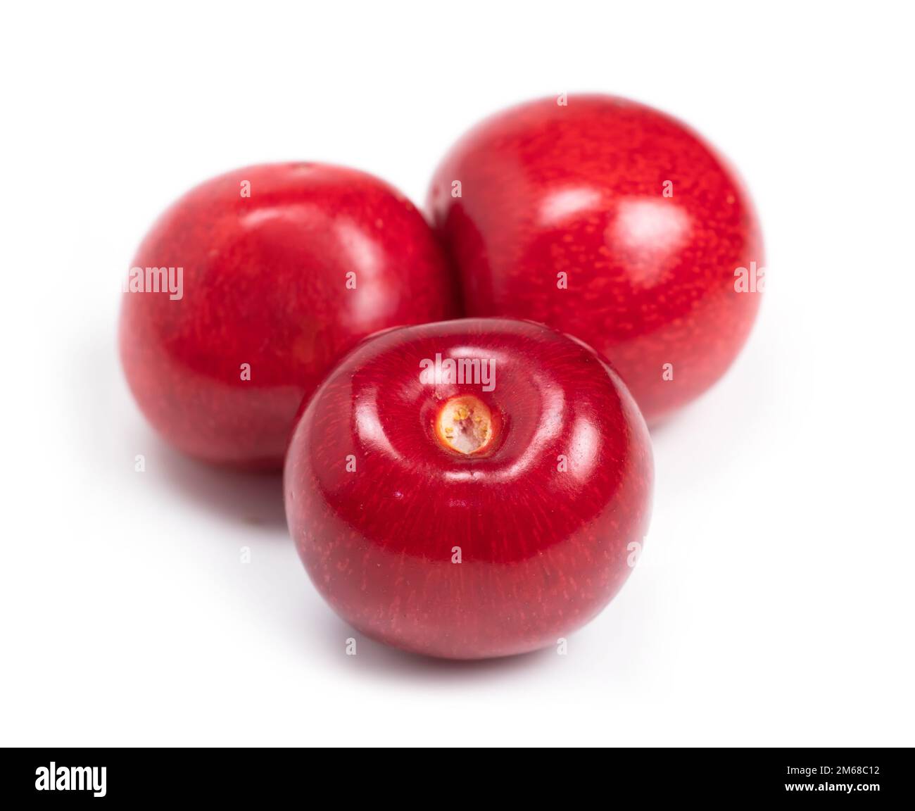 Three sweet cherries isolated on a white background Stock Photo - Alamy