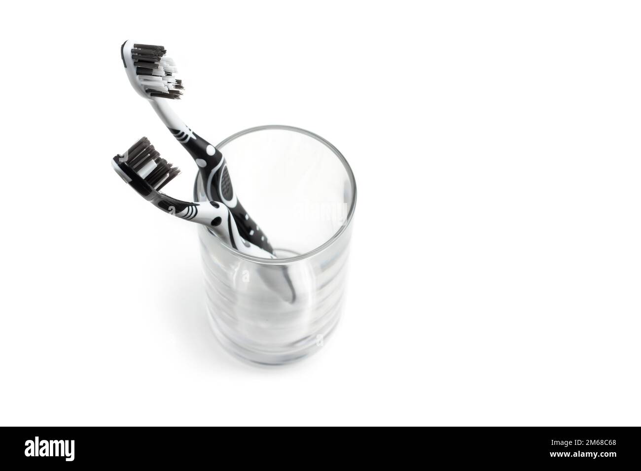 Toothbrushes on glass table Cut Out Stock Images & Pictures - Alamy