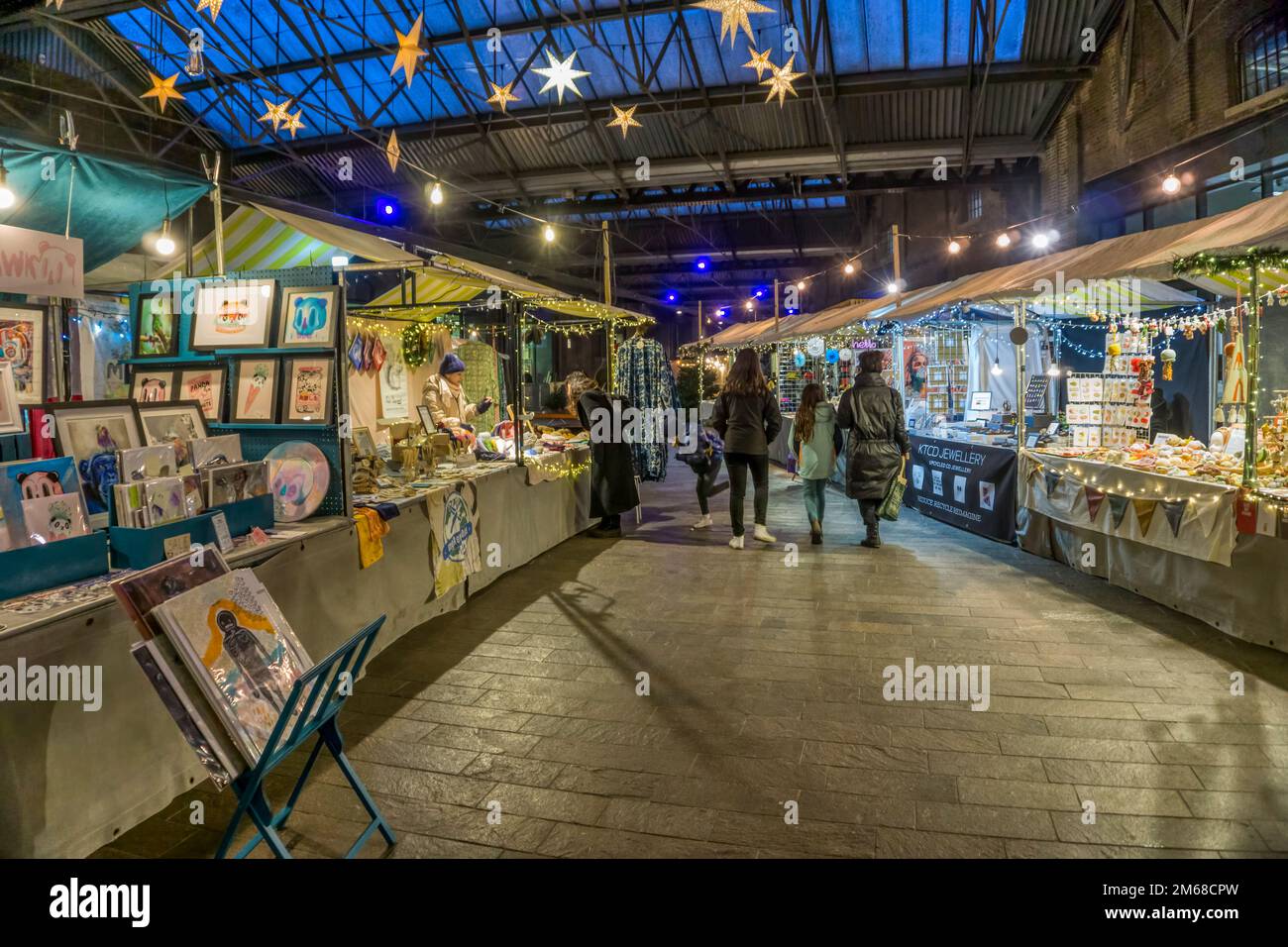 A night time view of people browsing round the Canopy Market at King's ...