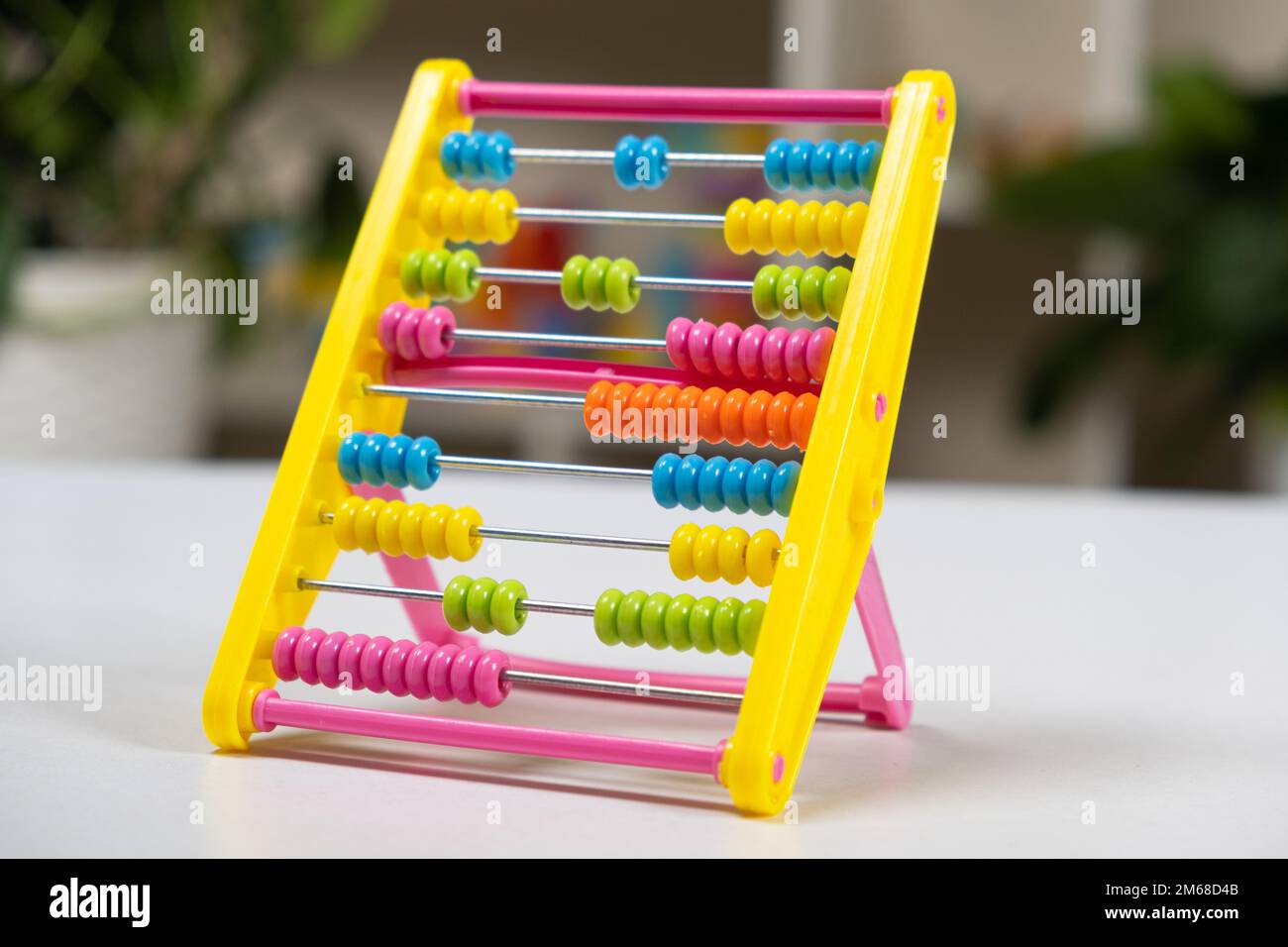 Colorful children's abacus on the table. Mathematics, arithmetic for ...