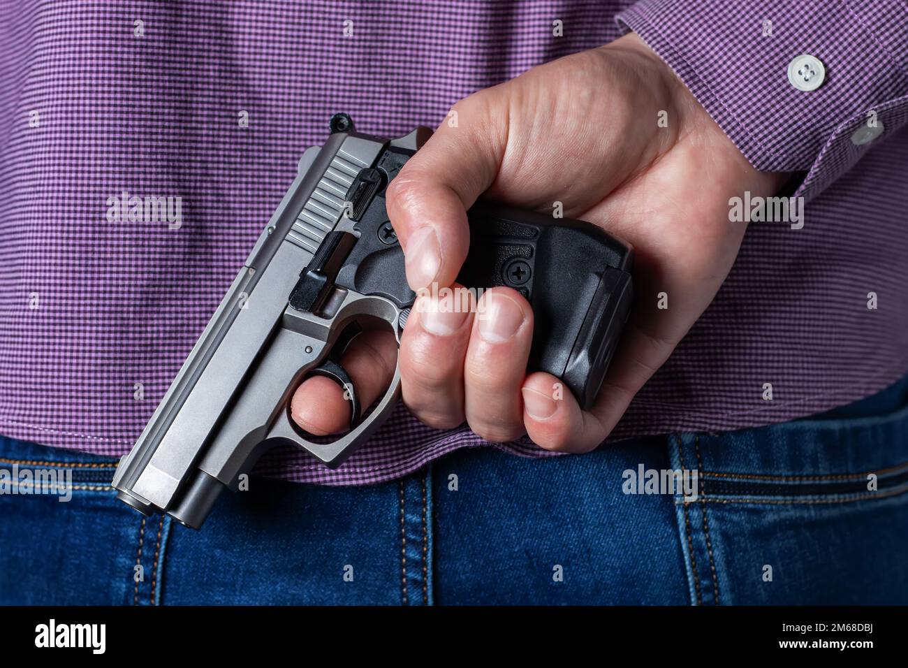 Pistol revolver in hand gangster hi-res stock photography and images ...