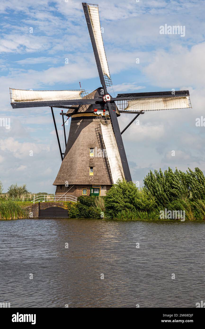 portrait of wind pump windmill at a canal Stock Photo - Alamy