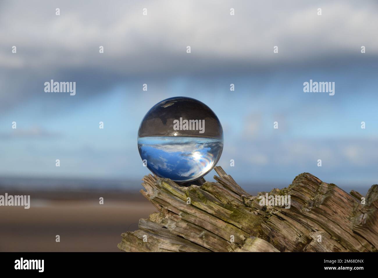 Seascapes through a lens ball Stock Photo - Alamy