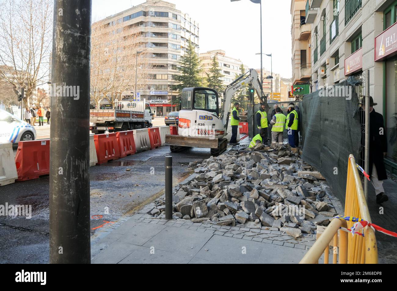 Works on a sidewalk in the city center due to a broken water pipe and ...