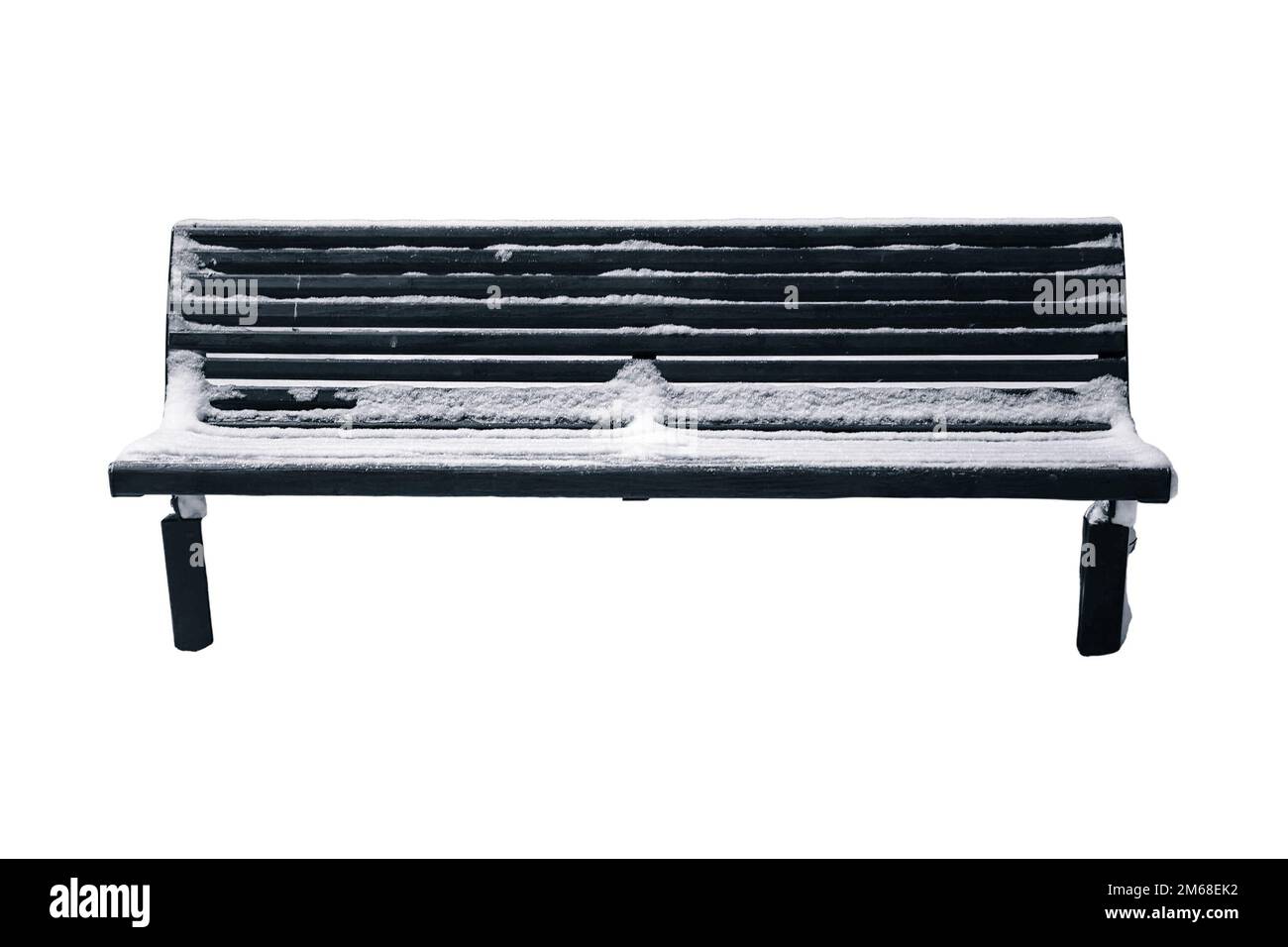 A bench in the snow stands in the dark in a night park, isolated on a ...