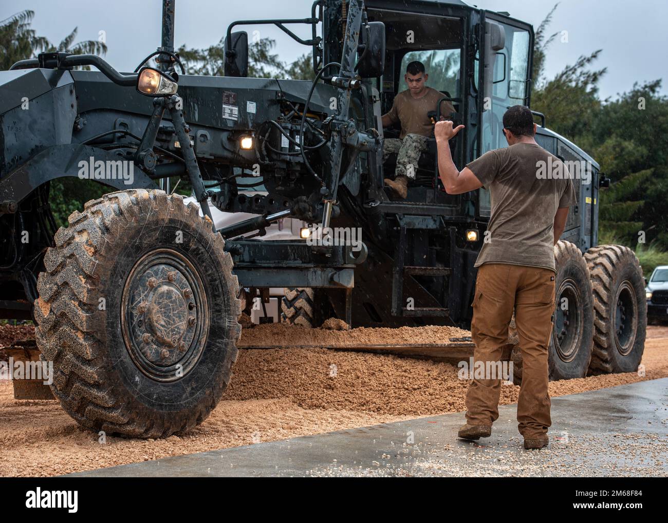 U.S. Navy Petty Officer 3rd Class Rama Rudolph, a Seabee assigned to ...