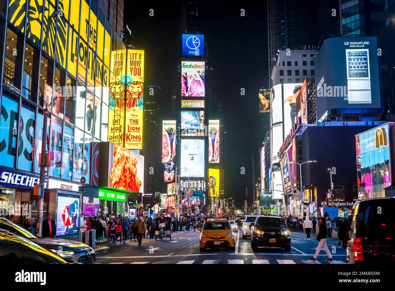 Broadway with traffic and advertising hoardings near Times Square at ...