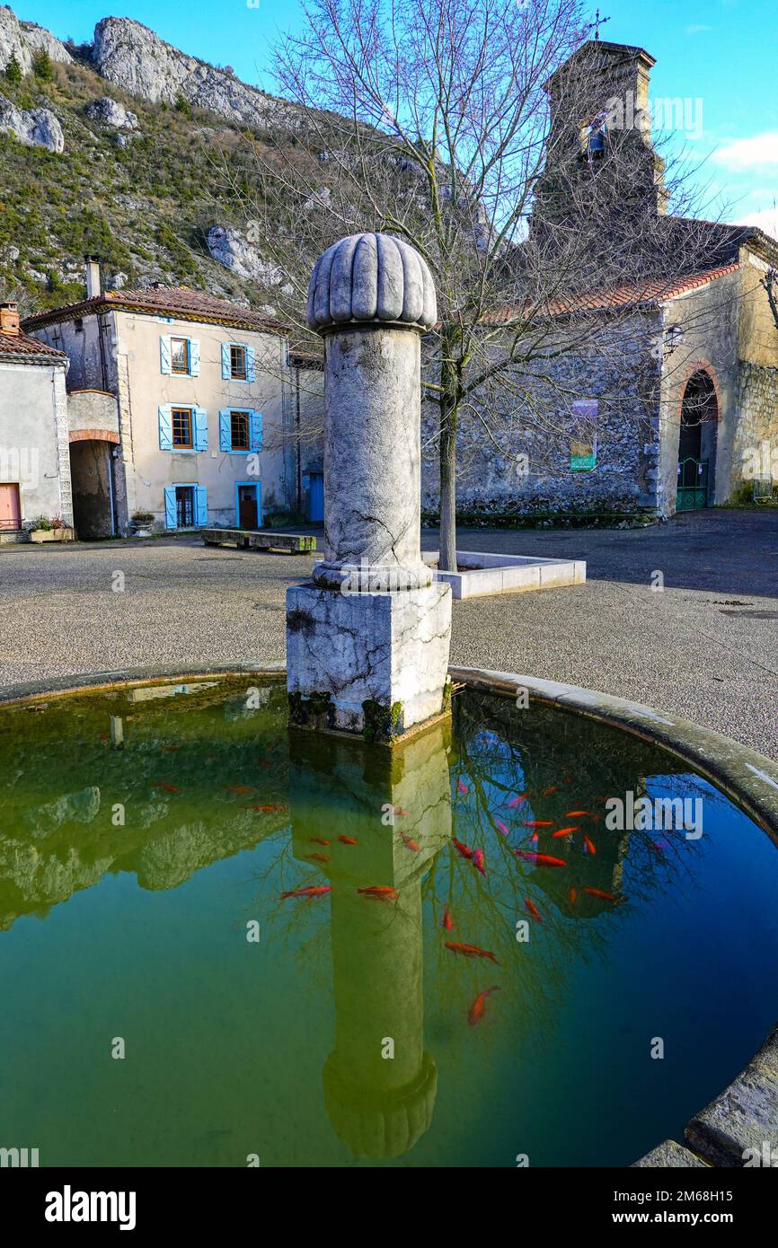Fountain with goldfish in The small village and castle at Roqefixade ...