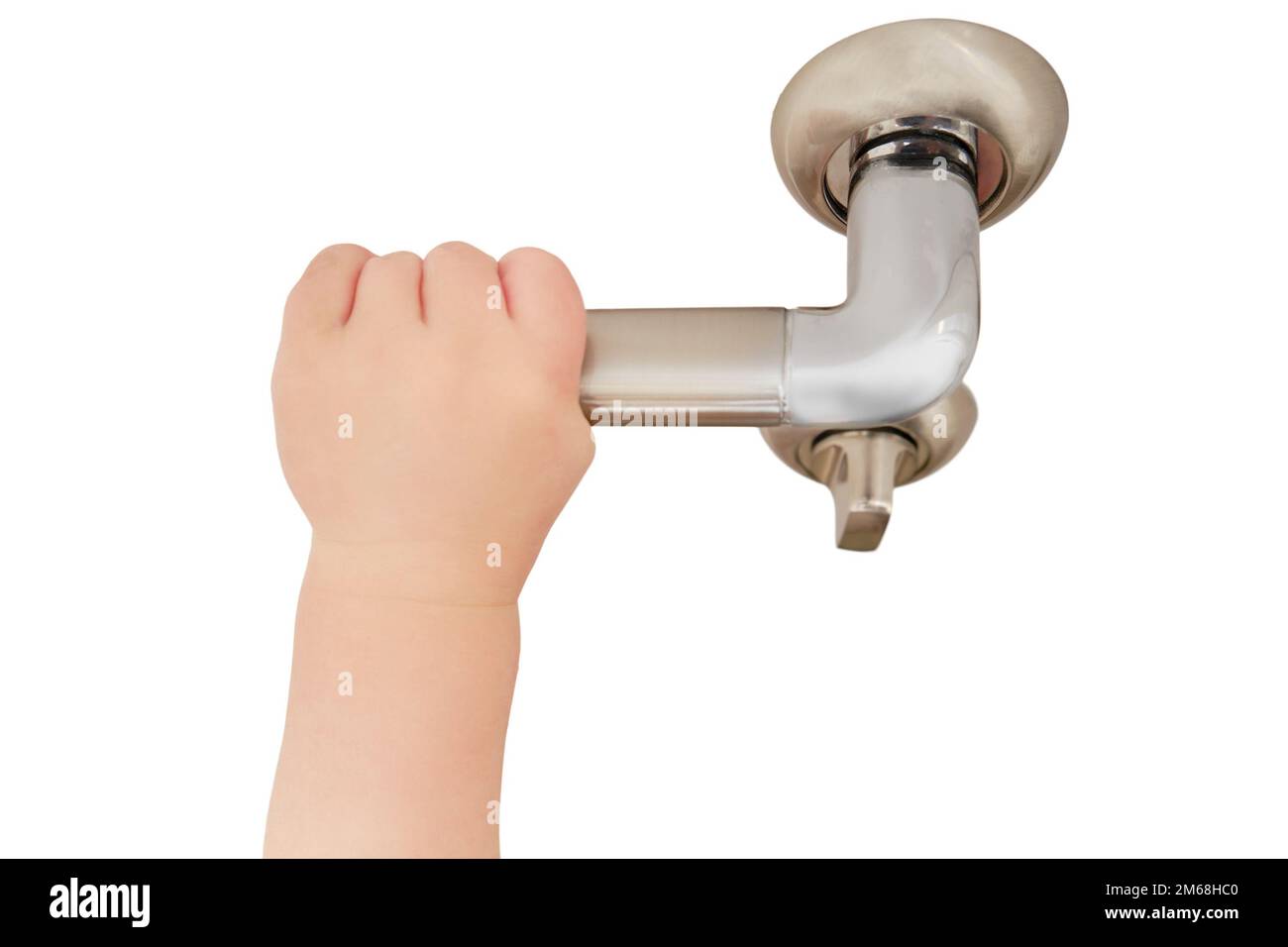 Toddler baby opens the door holding the door handle, child hand close ...