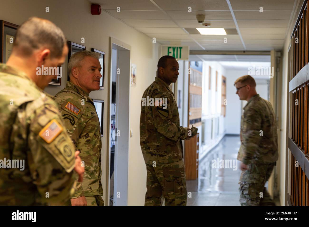 U.S. Army Europe and Africa’s Command Sgt. Maj. Jeremiah E. Inman surveys portraits within a ...