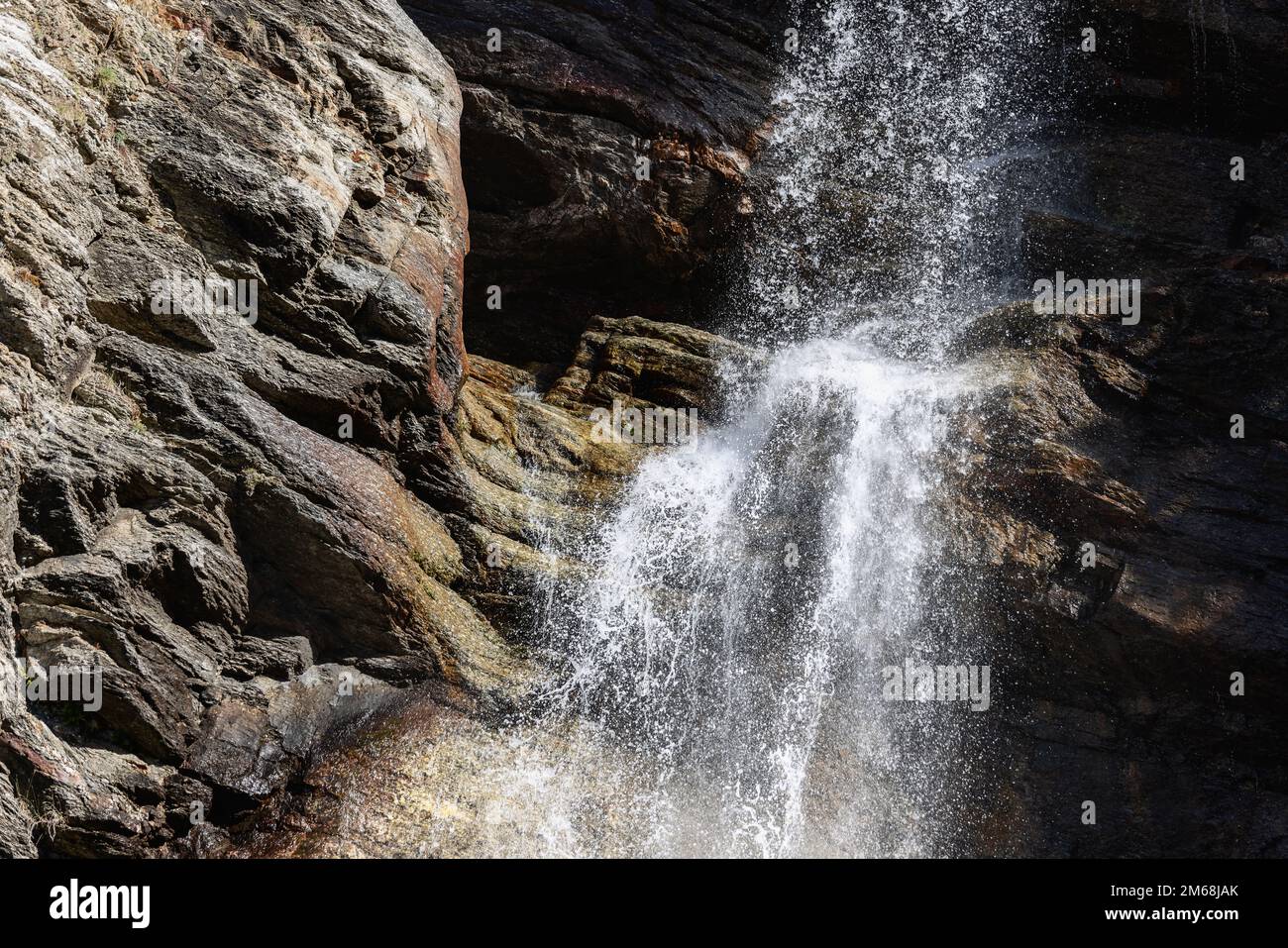 Gloomy centuries-old layers of karst granite rocks are washed by ...