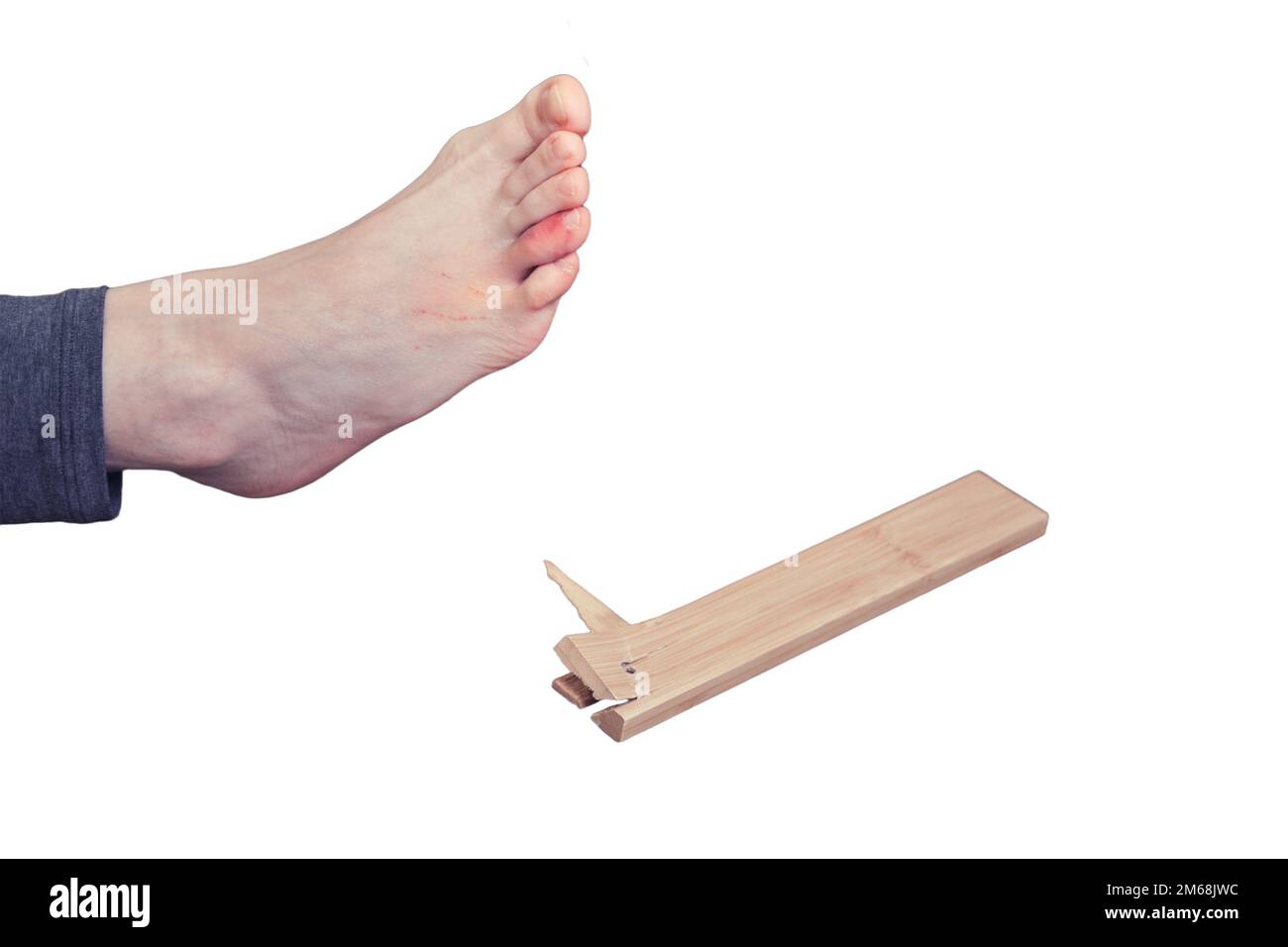 Young woman injured her foot due to falling from a broken chair ...