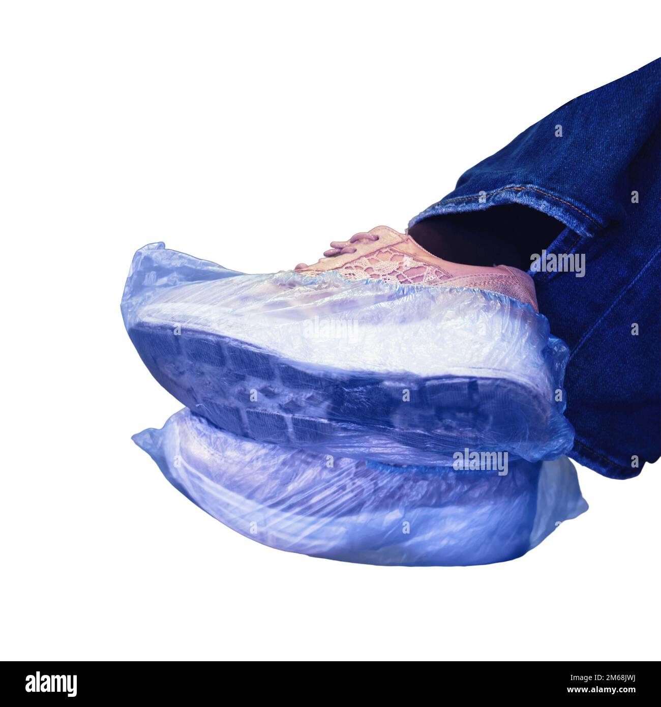 Shoes in shoe covers on a woman leg in a hospital, isolated on a white ...