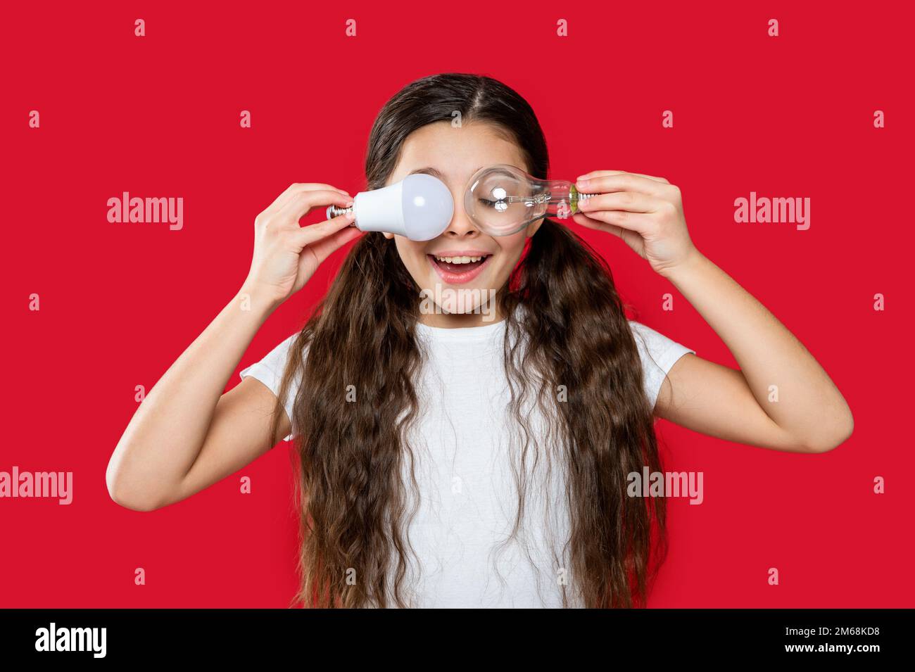 cheerful teen girl with lightbulb on background. photo of teen girl ...