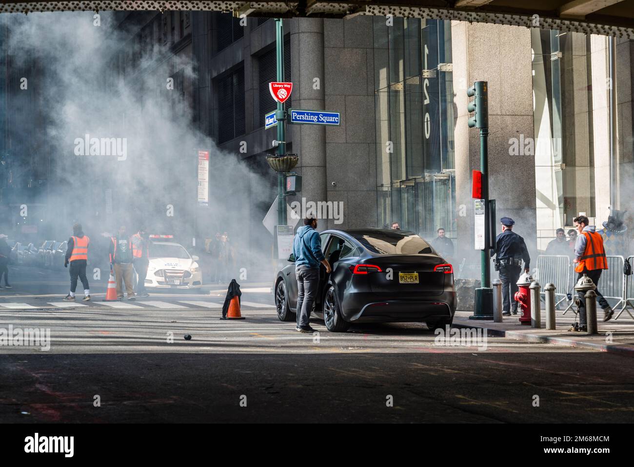 Car in smoke, shooting an advertisement, Midtown Manhattan, New York ...