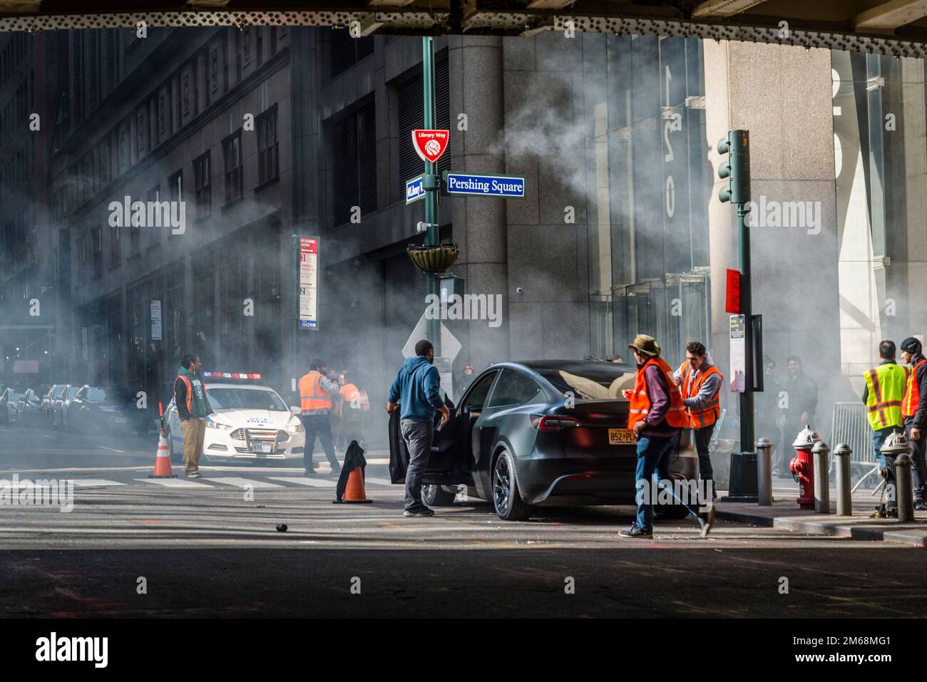 Car in smoke, shooting an advertisement, Midtown Manhattan, New York ...