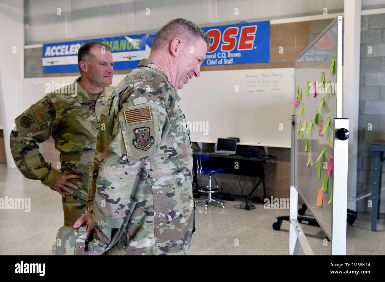 Chief Master Sgt. Chad Bickley, 18th Air Force command chief, right ...