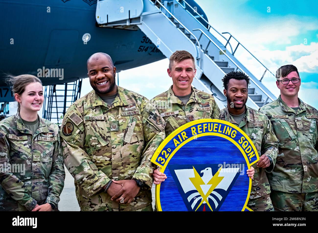 U.S. Air Force Airmen assigned to the 32nd Air Refueling Squadron pose ...