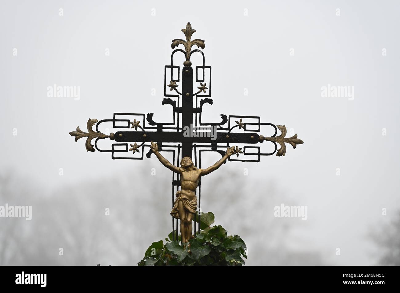 Vienna, Austria.Vienna Central Cemetery. Metal cross with Jesus at the ...