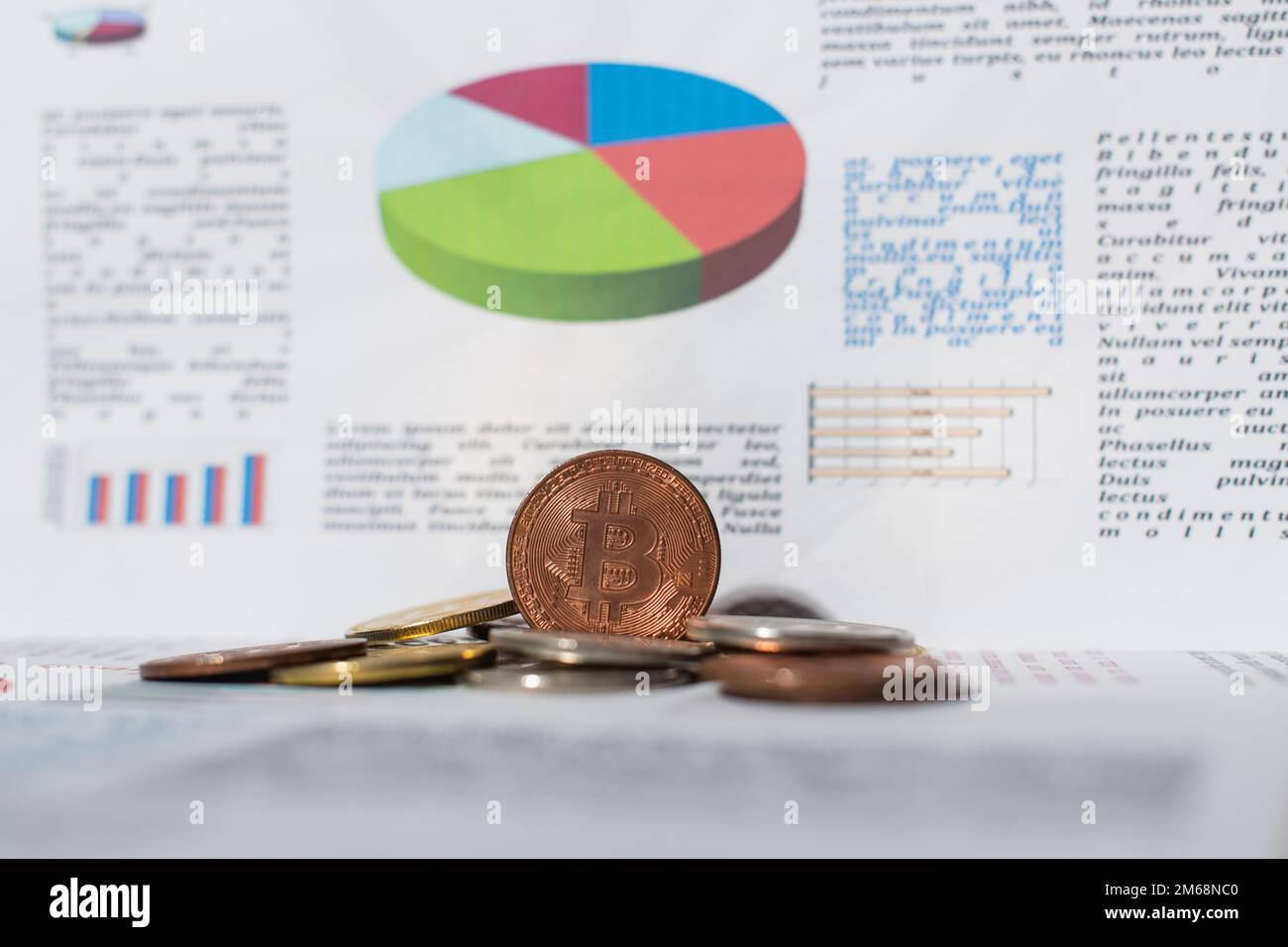 KYIV, UKRAINE - NOVEMBER 17, 2022: selective focus of bitcoins near ...