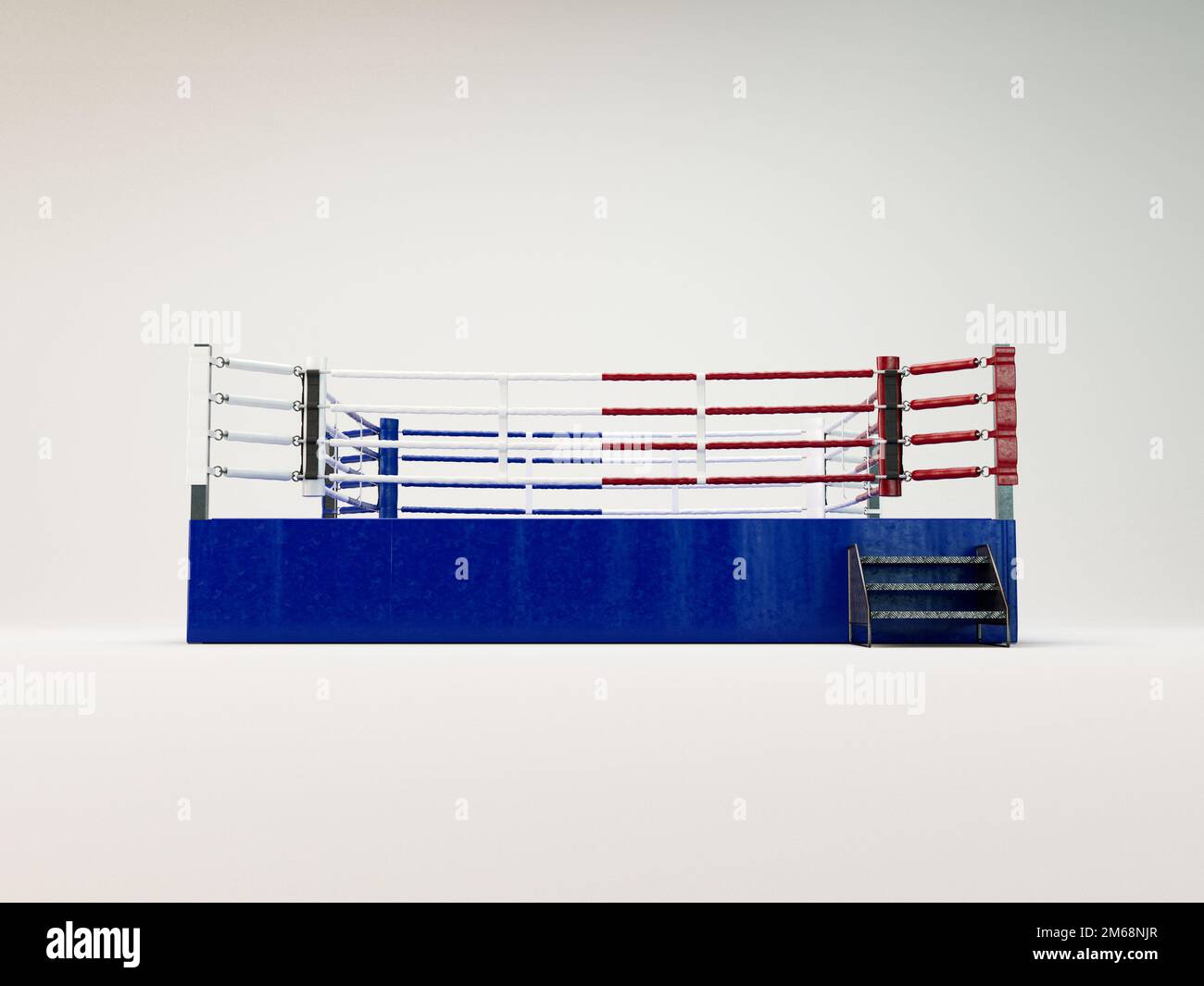 A modern regulation sized boxing ring with opposing blue and red ...
