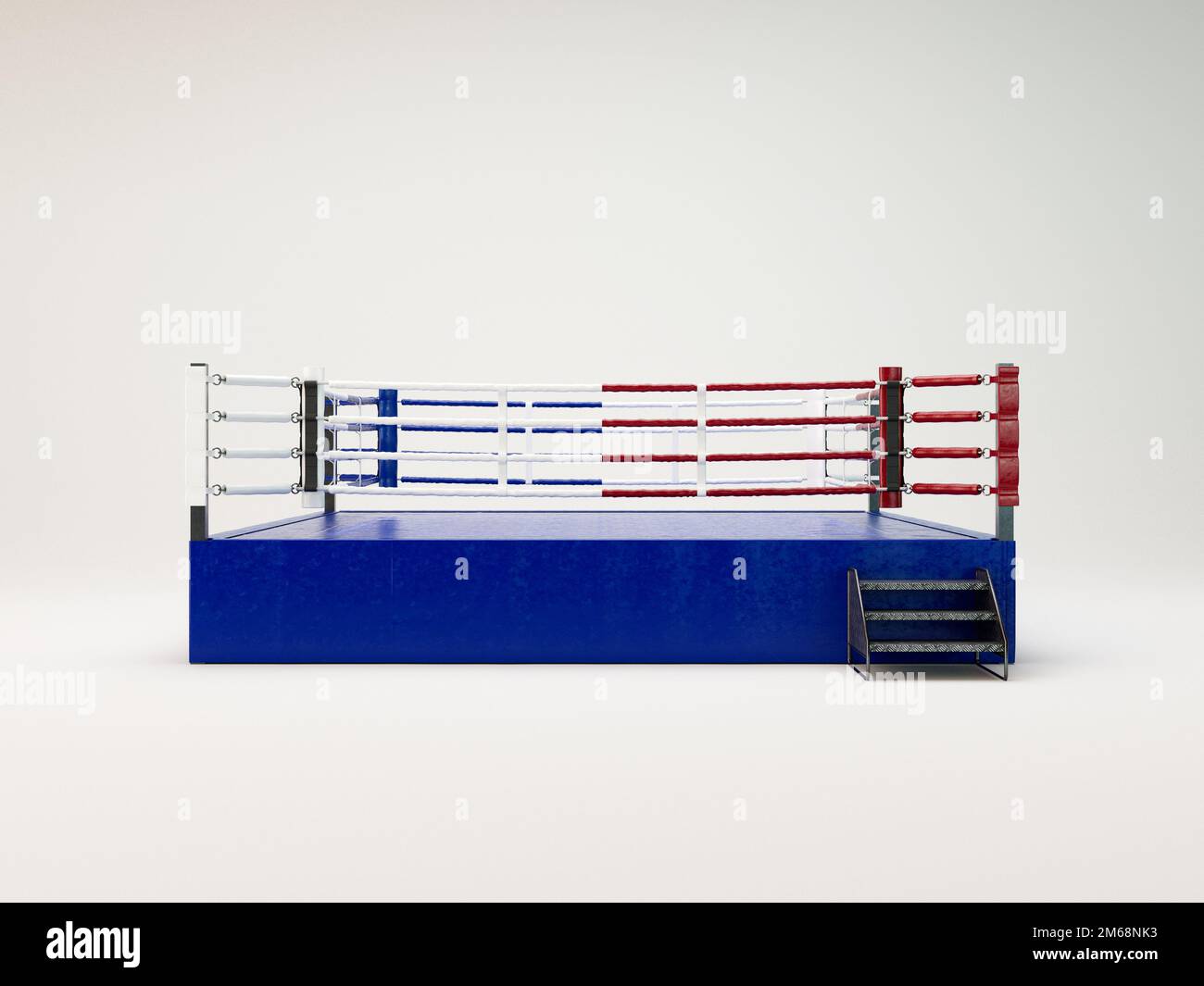 A modern regulation sized boxing ring with opposing blue and red ...