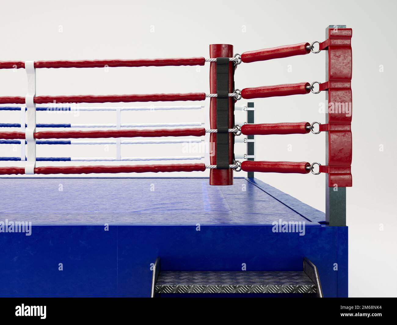 A modern regulation sized boxing ring with opposing blue and red ...