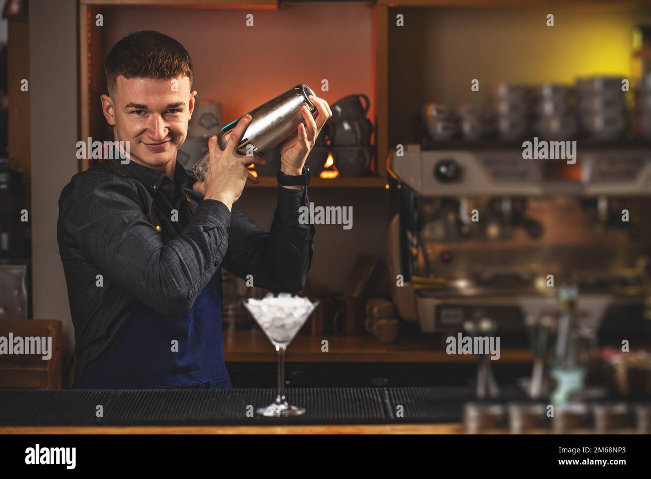 Expert barman is making cocktail at bar Stock Photo - Alamy