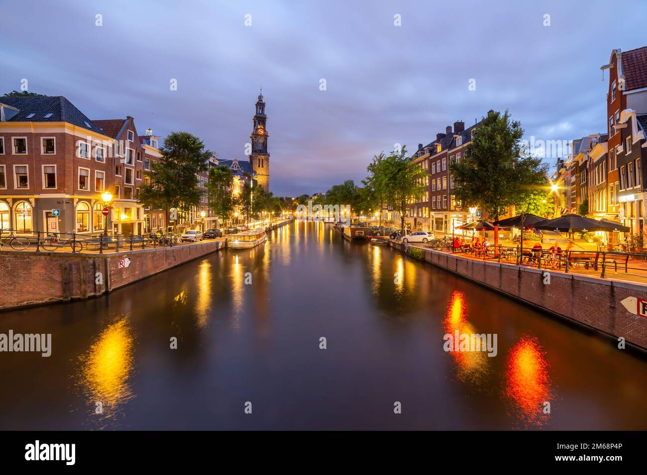 evening view on prinsengracht in amsterdam with westkerk lanterns ...