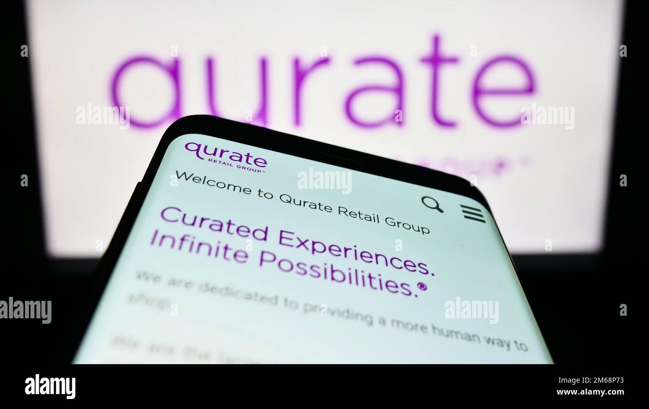 Mobile phone with website of US media company Qurate Retail Inc. on ...