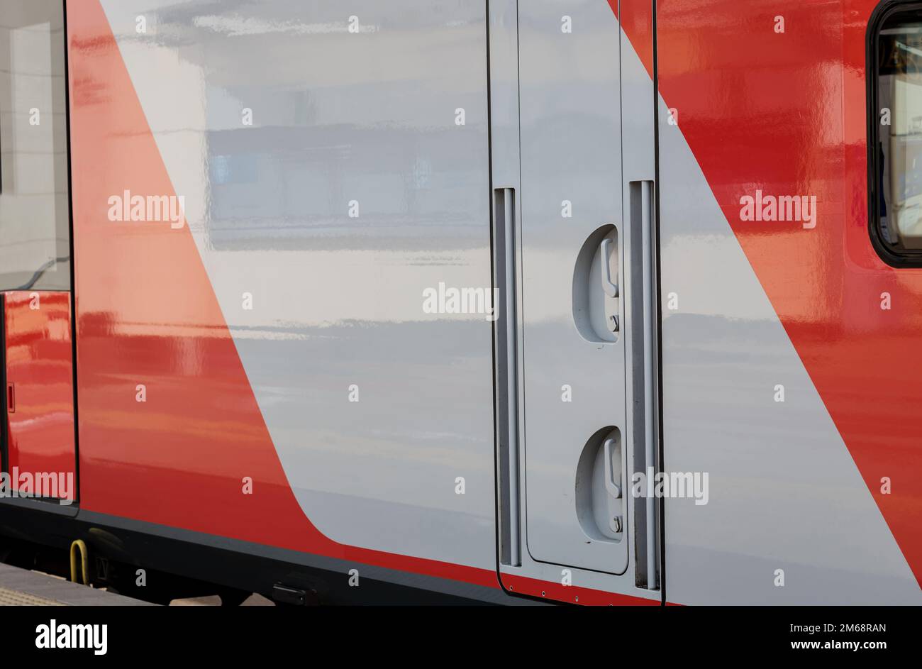 train car with closed doors at the station. red modern high speed ...