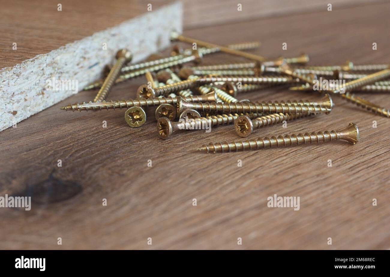 wood screws on melamine manufactured wood panel Stock Photo - Alamy