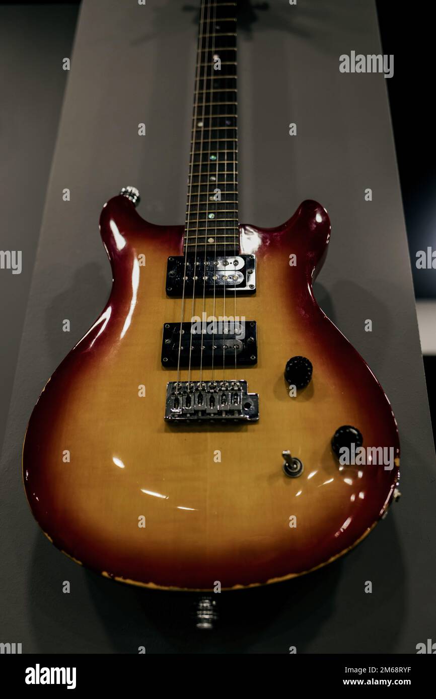 Electro guitar on a decorative wall. musical instrument Stock Photo - Alamy