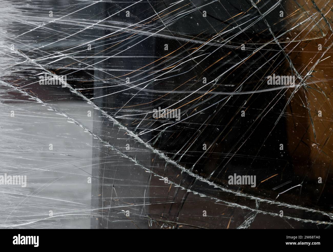 a lot of cracks on the window. broken glass Stock Photo - Alamy