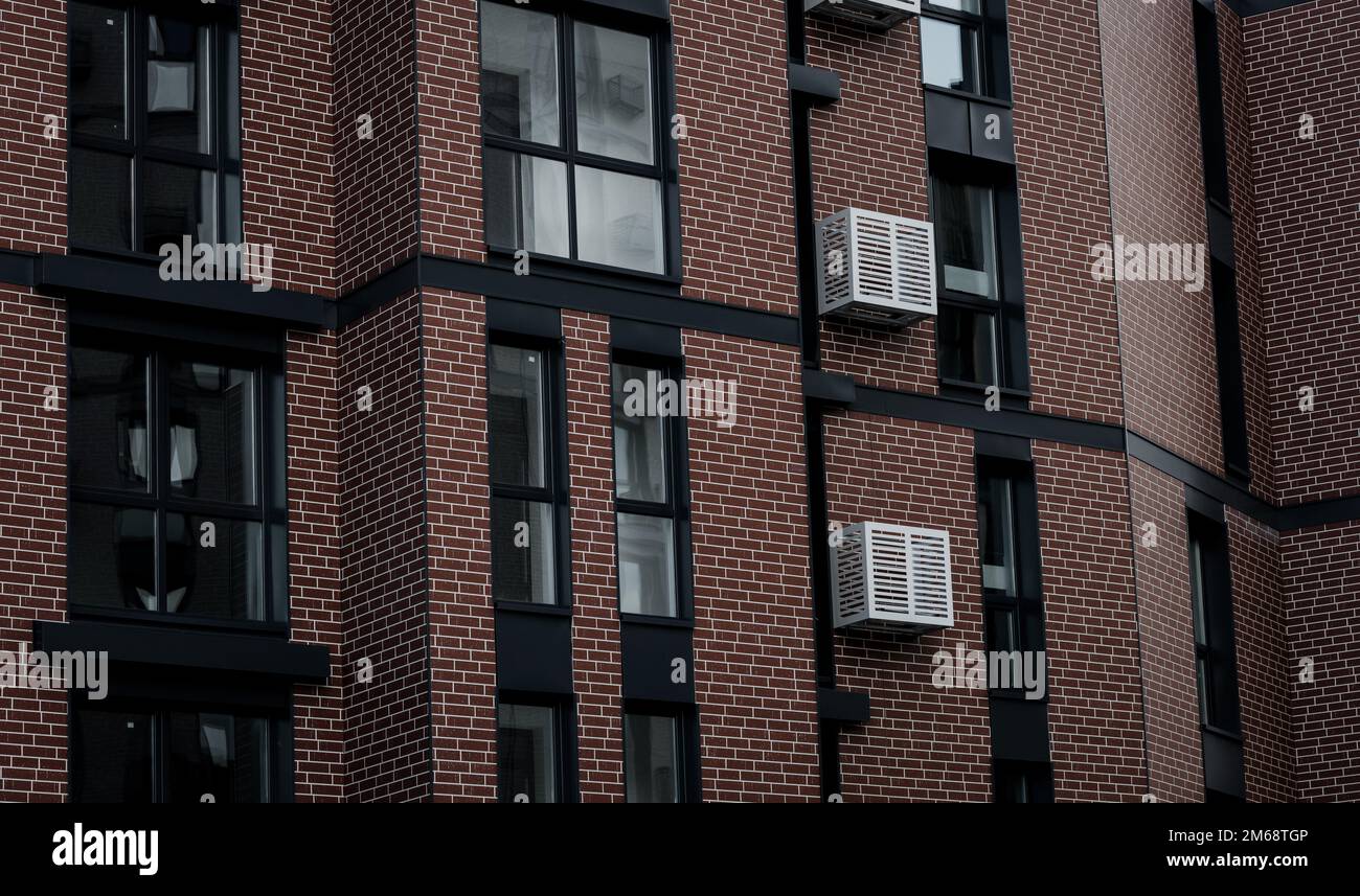 Facade of brick modern building with big glass windows. luxury ...