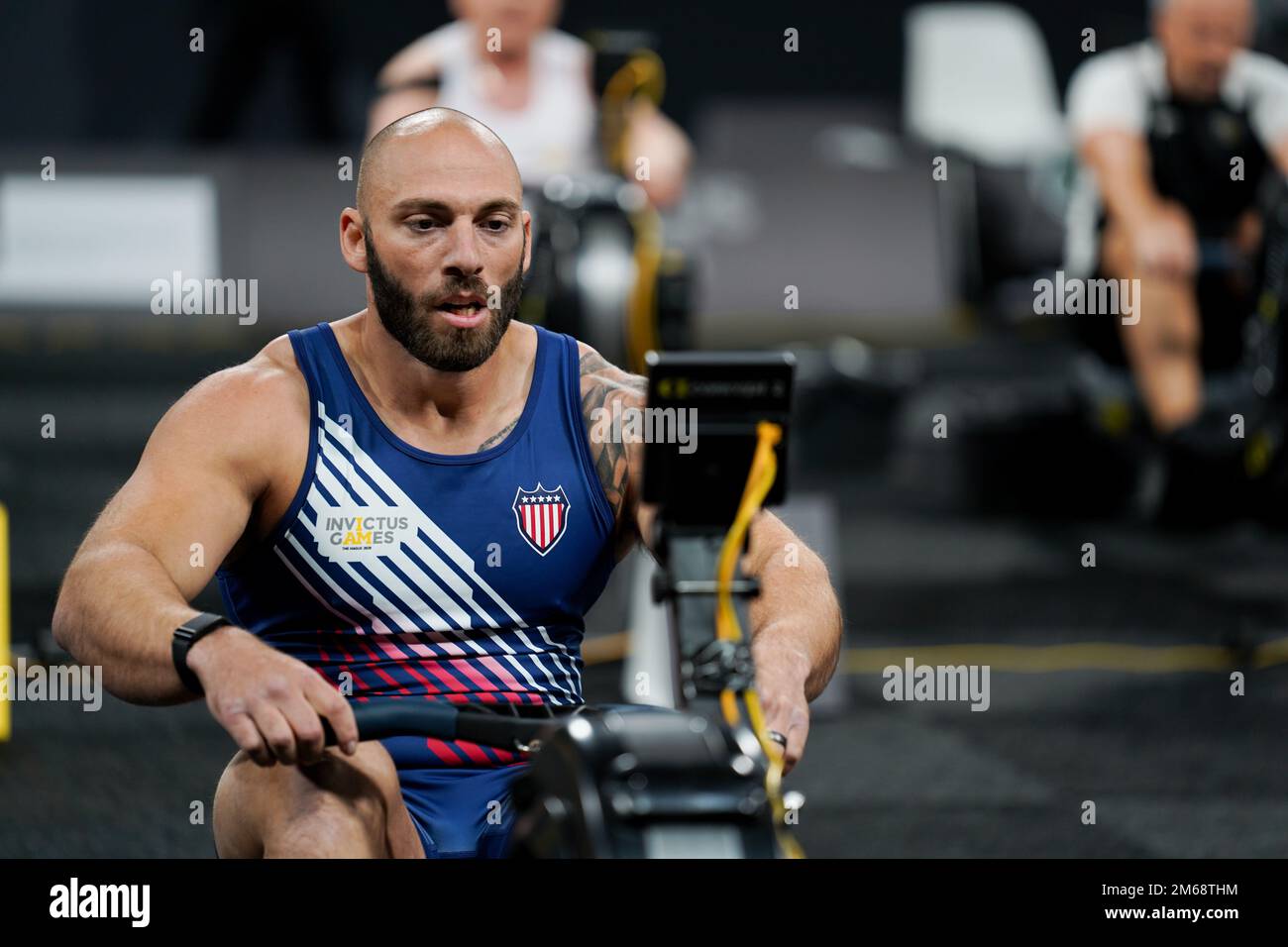 U.S. Air Force Staff Sgt. Matt Cable rows during the 4-minute endurance ...