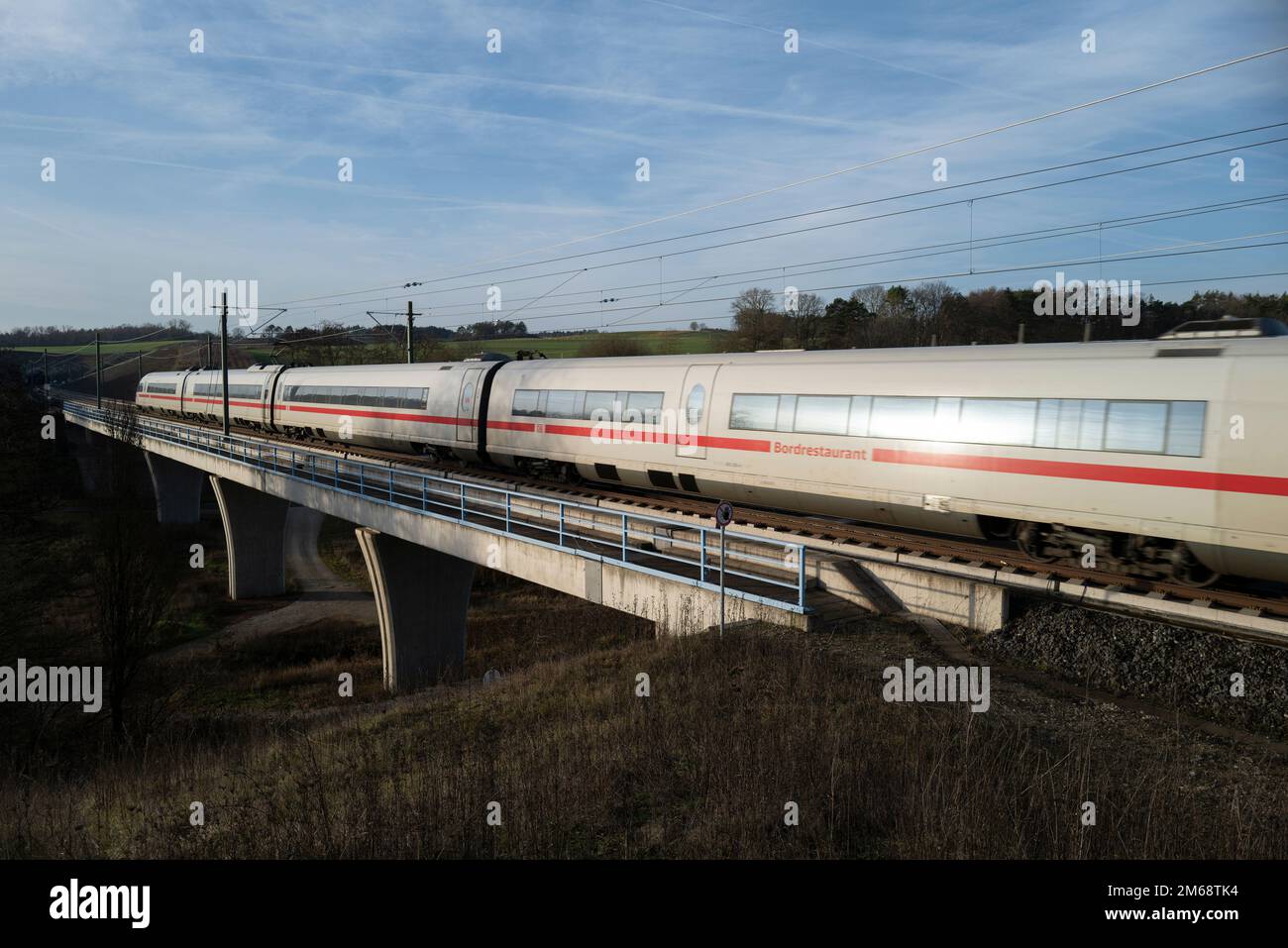 A Deutsche Bahn train crosses the Bavarian countryside near Coburg ...