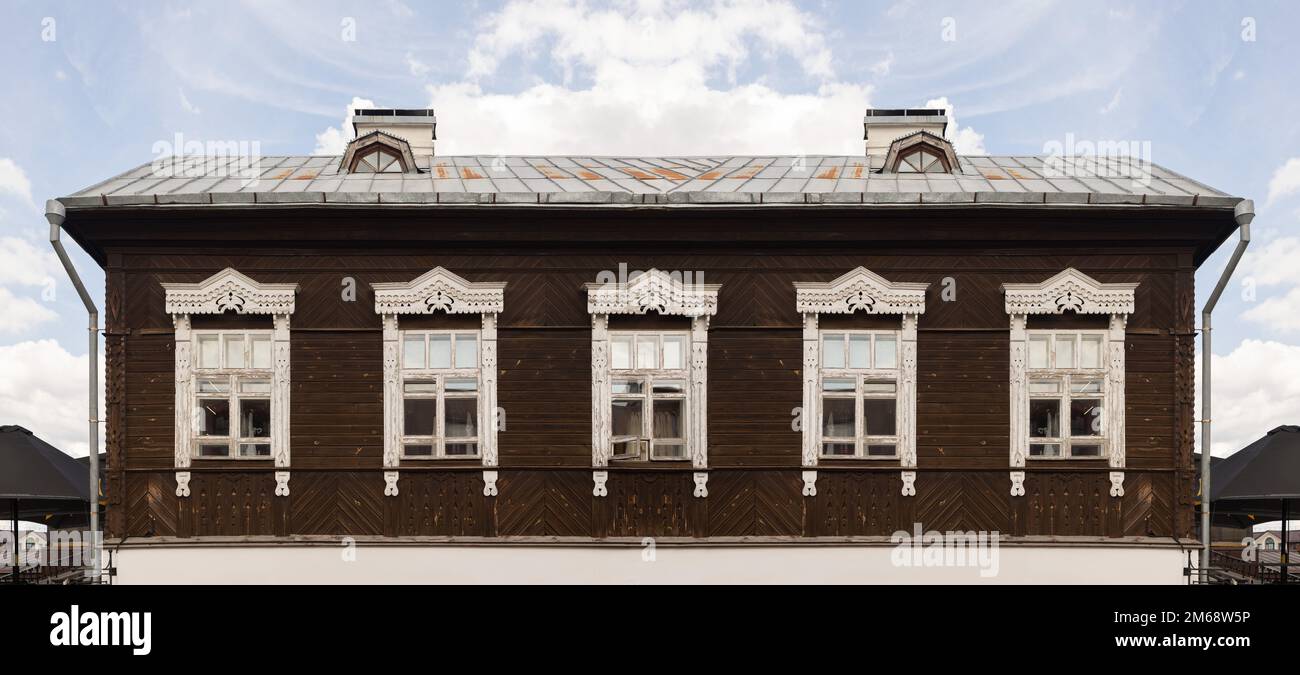 Texture background, window on the wall of a wooden and stone house ...