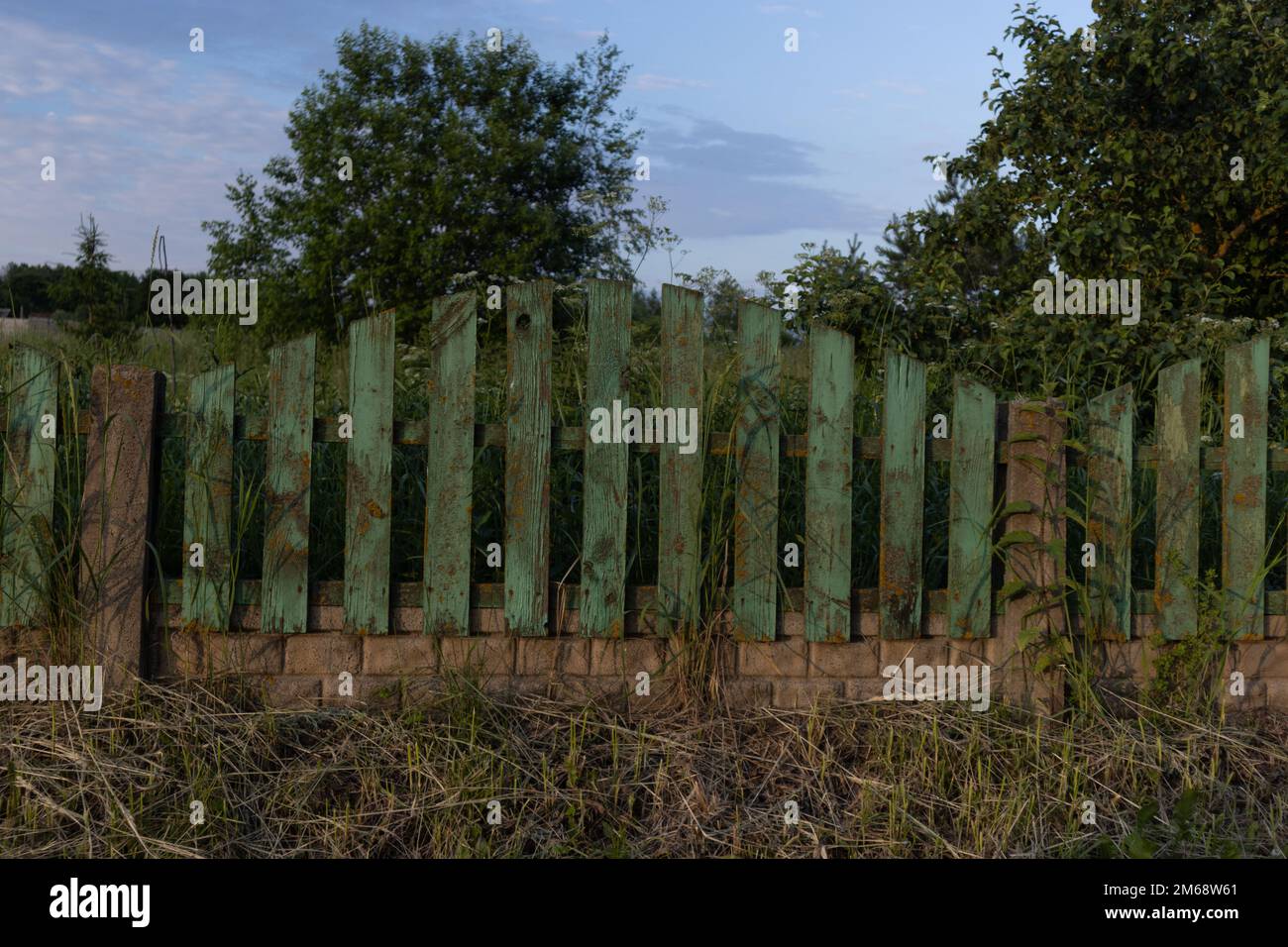 Wooden fence and railing in a rustic style on a summer day Stock Photo ...