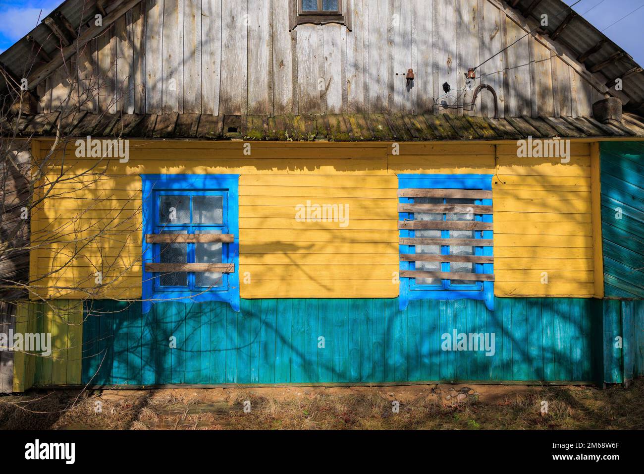 Texture background, window on the wall of a wooden and stone house ...
