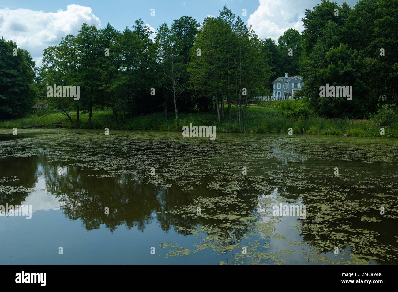 Buildings and houses standing on the shore of a lake, river or sea ...