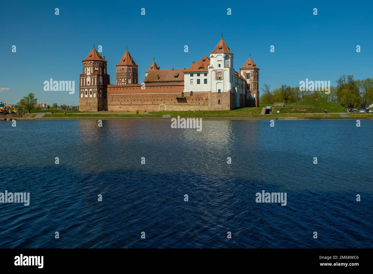Buildings and houses standing on the shore of a lake, river or sea ...