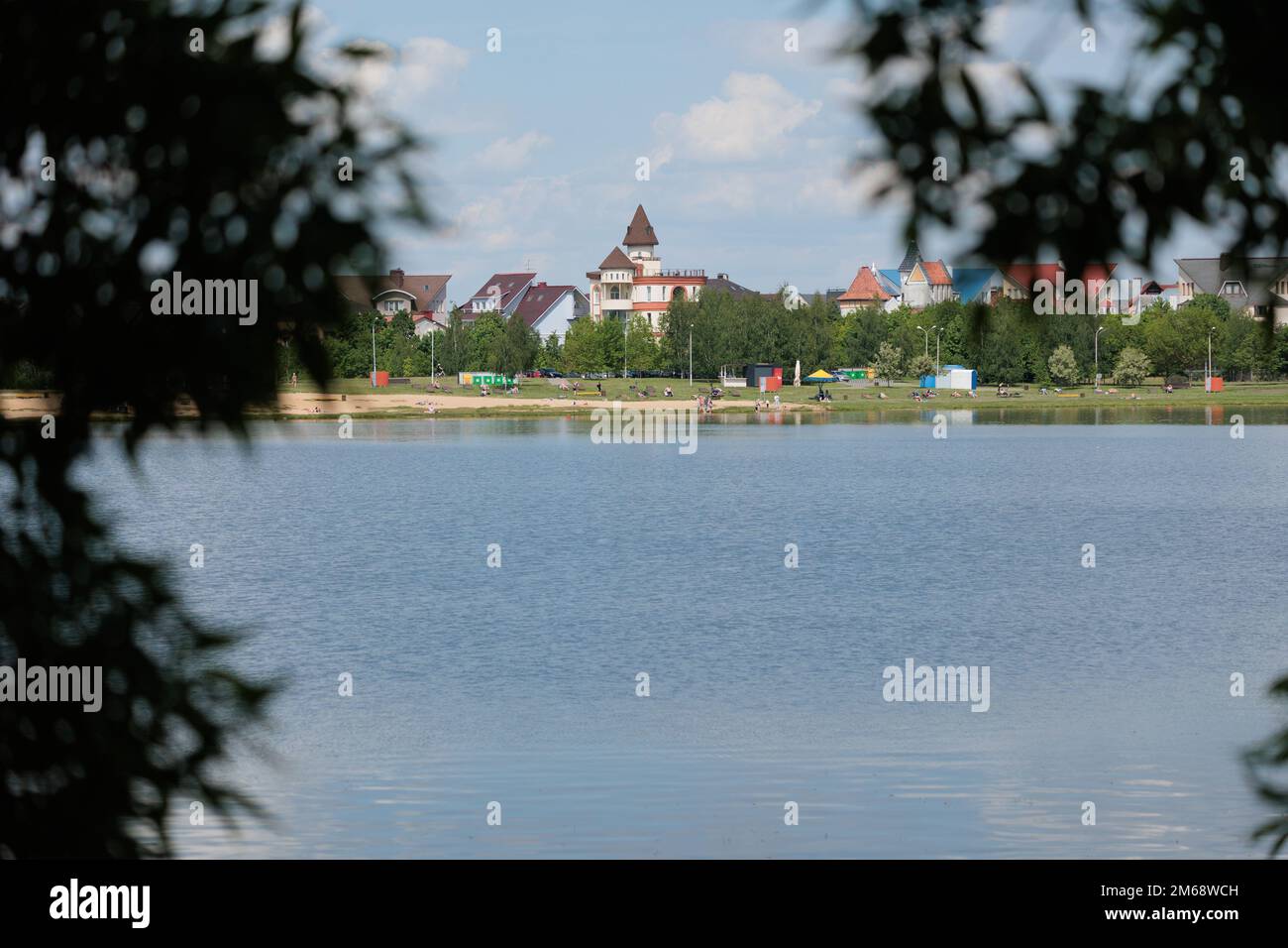 Buildings and houses standing on the shore of a lake, river or sea ...