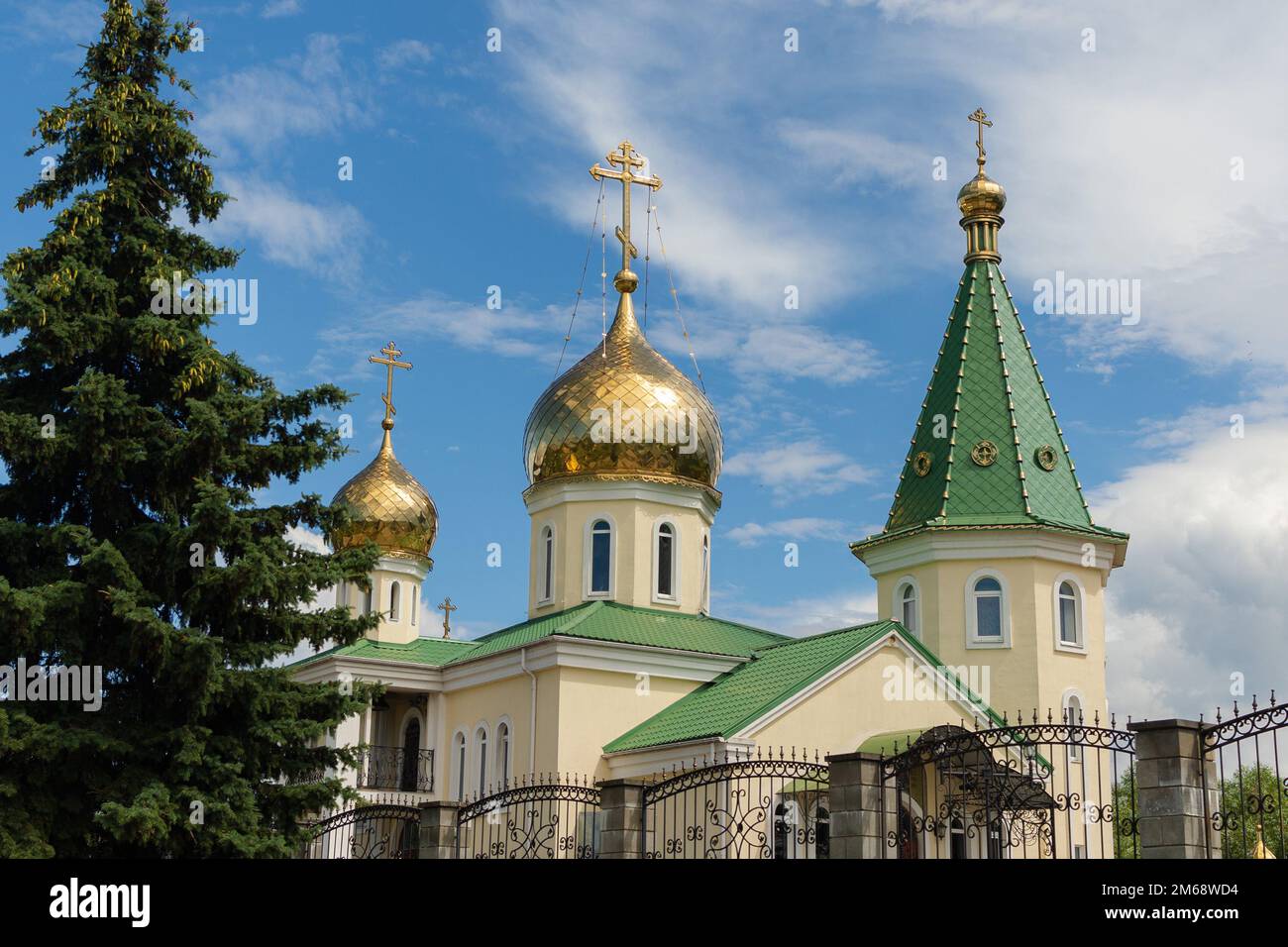 Small Orthodox church with golden domes Stock Photo - Alamy