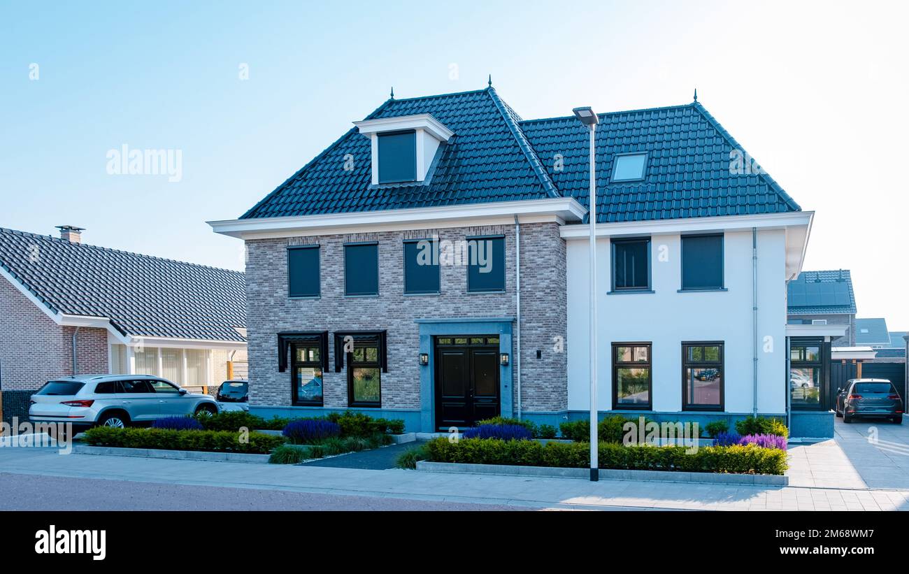 Dutch Suburban area with modern family houses, newly build modern ...