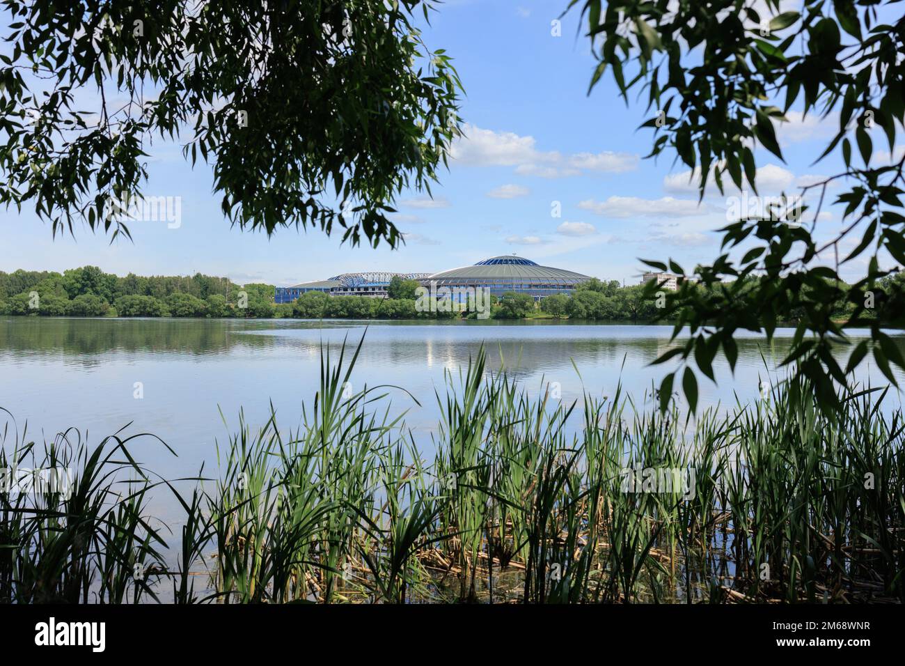 Buildings and houses standing on the shore of a lake, river or sea ...